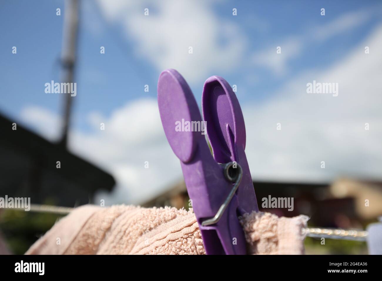 Domestic Washing hanging on a line with plastic pegs Stock Photo - Alamy