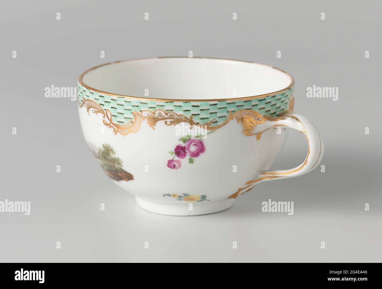 . Low cup with ear, painted porcelain. The head is painted with ...
