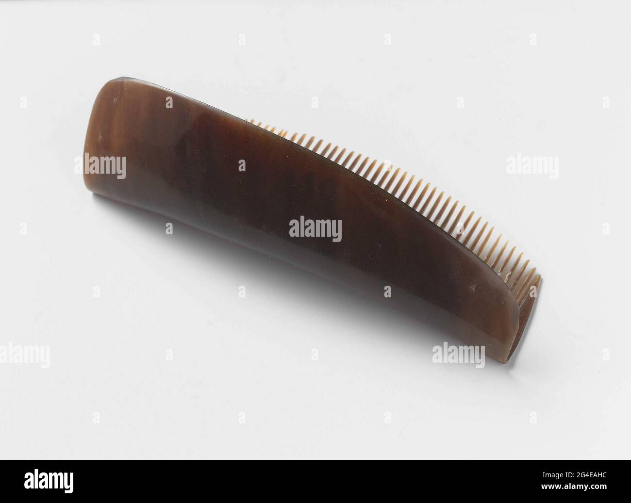 . Hair comb of turtle and horn with an unmedged tapered back that is ...
