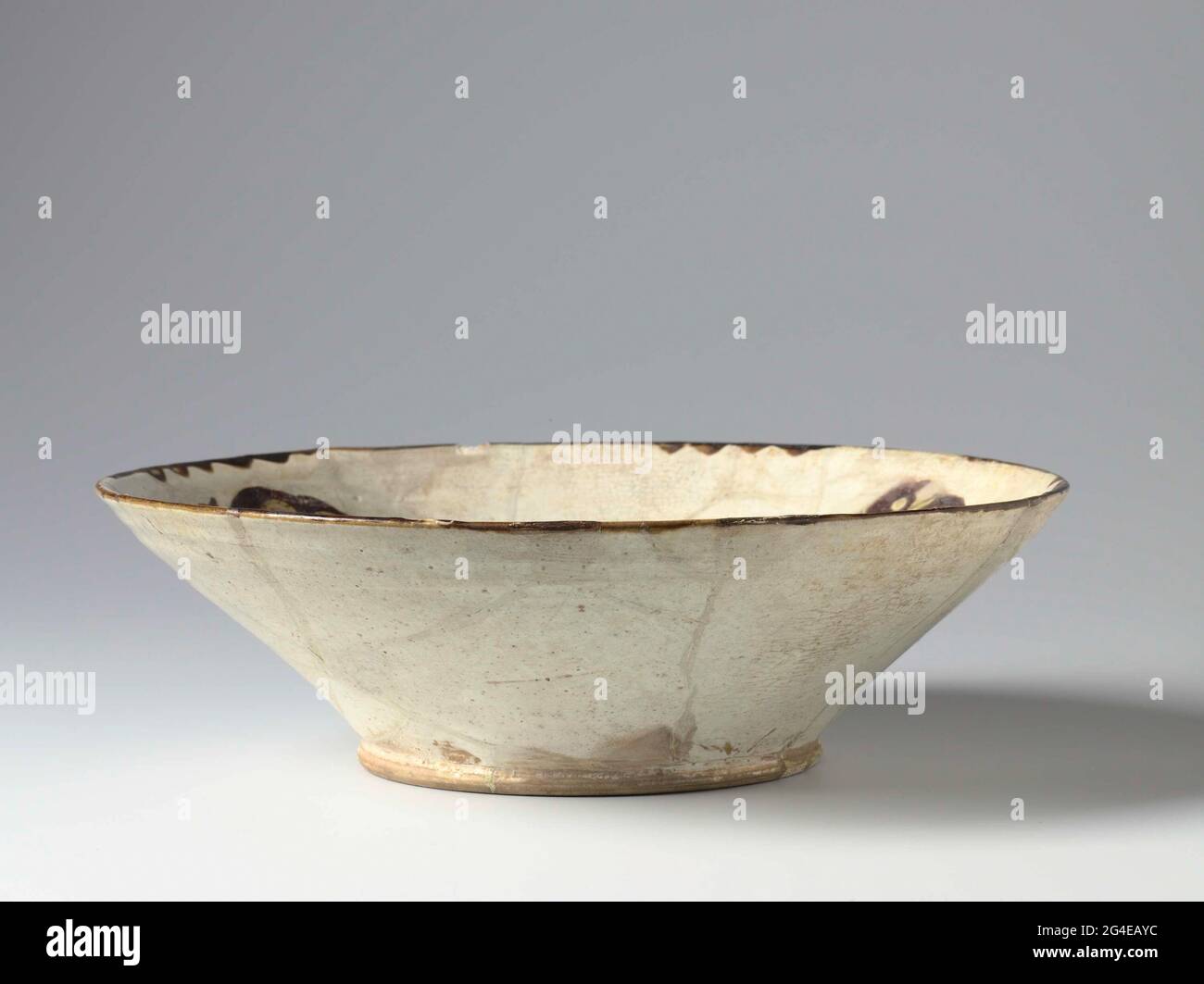 . Come of pottery with white sludge and a painting with colored sludge ...