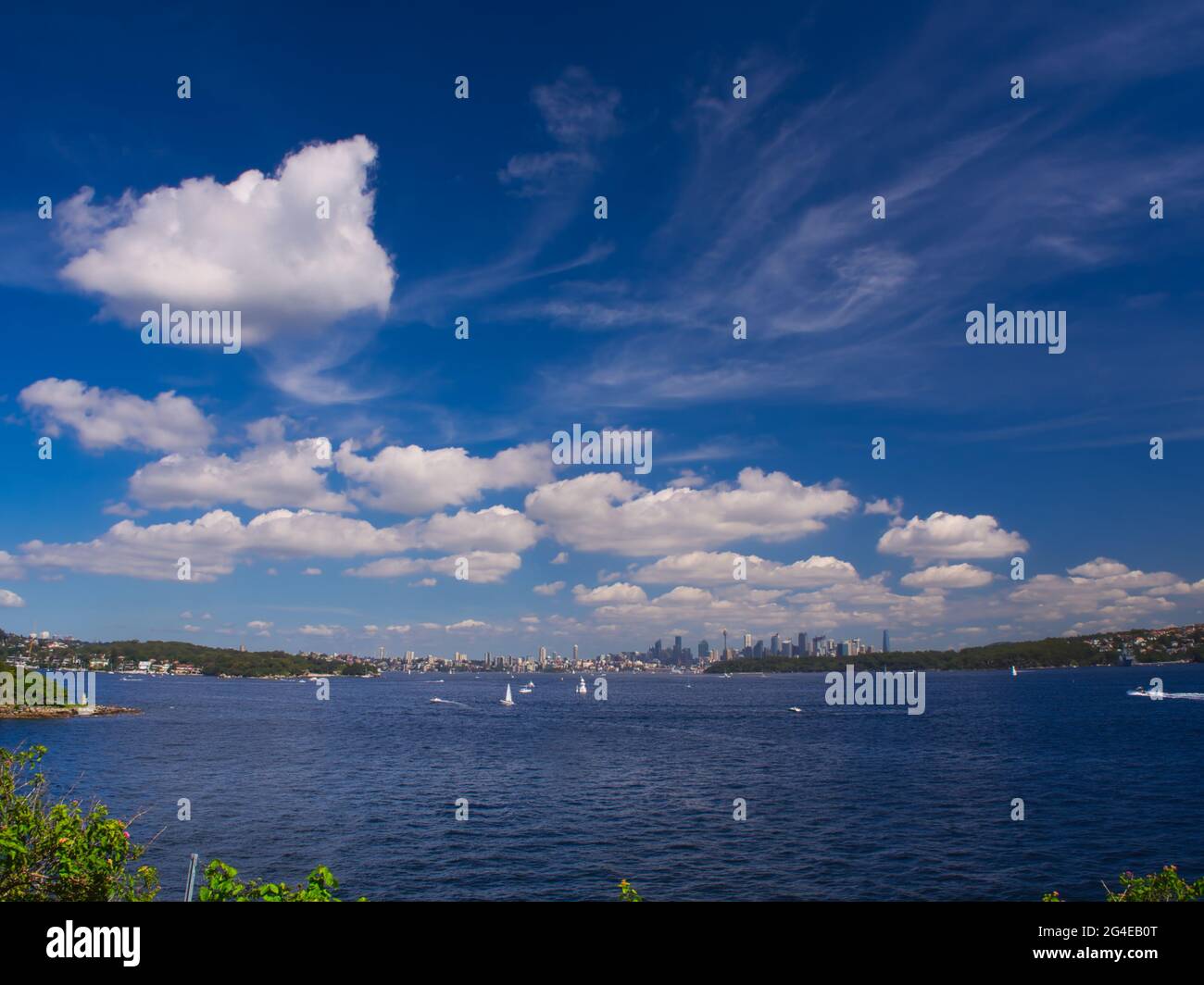 A beautiful seascape of Lady Bay out to the vast ocean with boats and ...