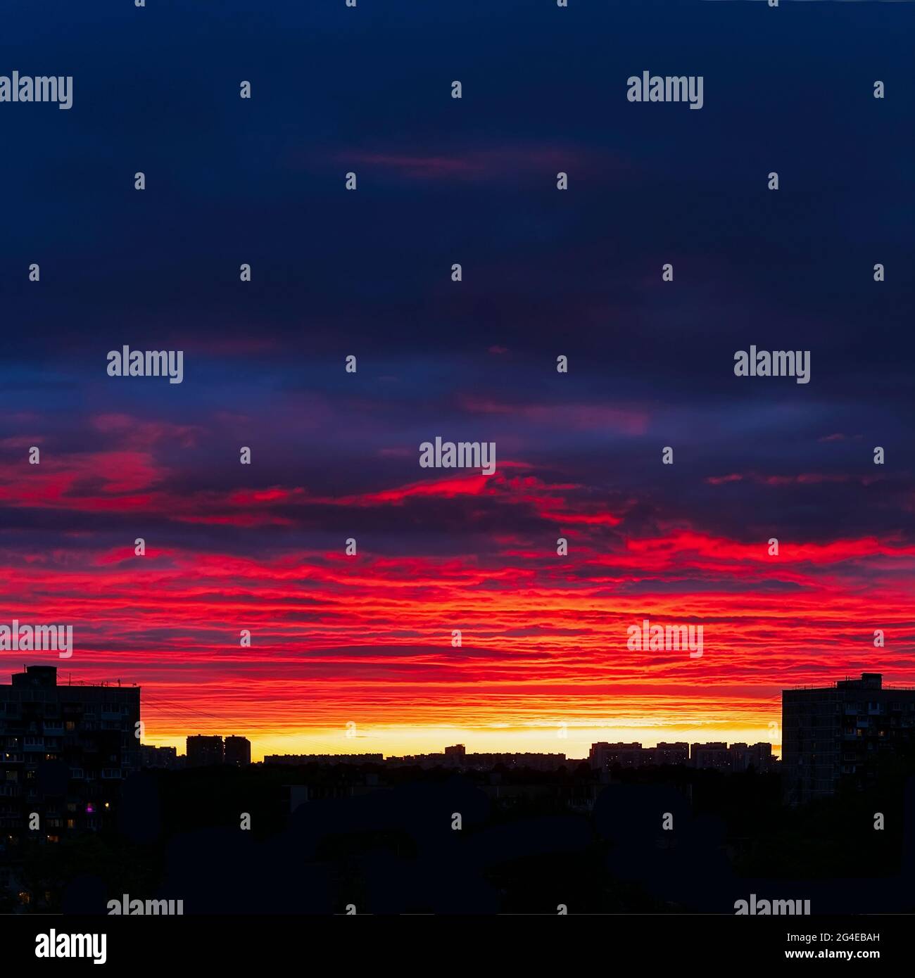 Horizon overlook. Dark colorful sky at sunset above dark silhouettes of ...