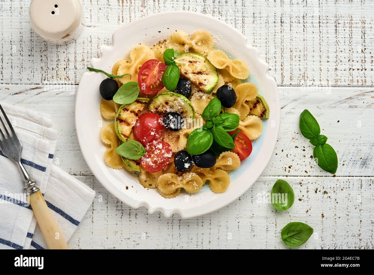 Pasta fiocchi salad with vegetables grilled zucchini, cherry tomato ...