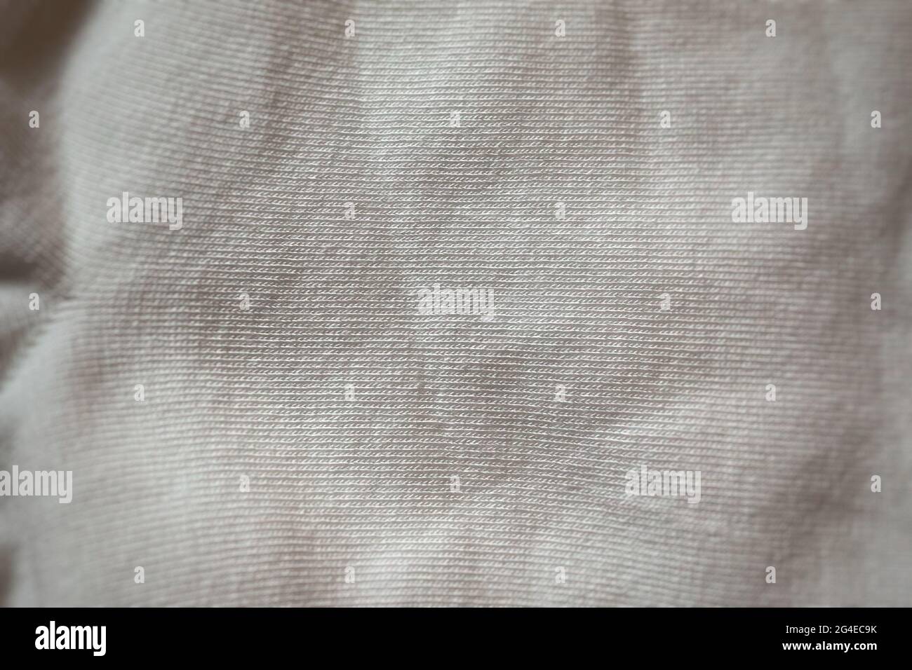 A closeup of a blurred cotton textile background with free space for ...