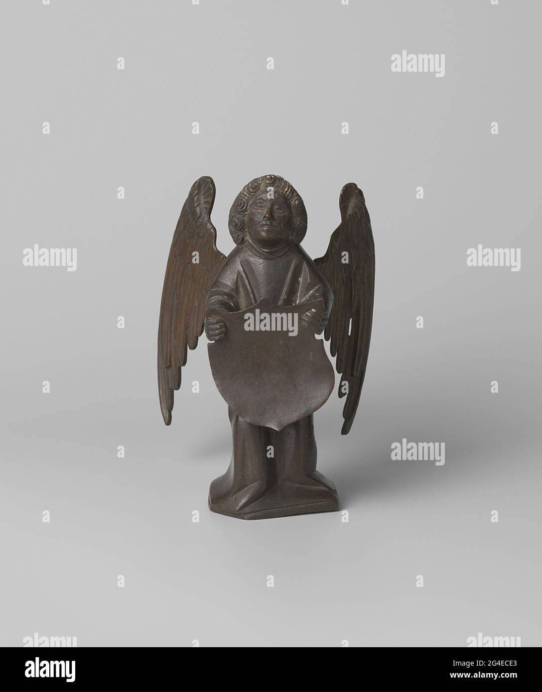 Figure of angel with coat of arms, part candles wreath. The figure is ...