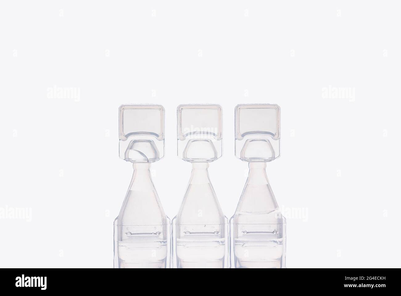 Eye drop bottles on white background. Blank white plastic containers ...