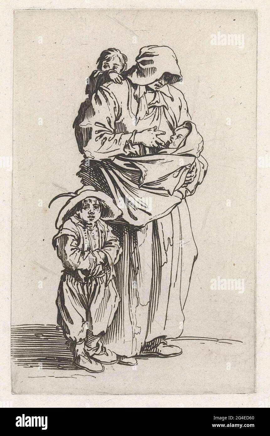 . Woman dressed in rags, seen from the front, a little boy on her right ...
