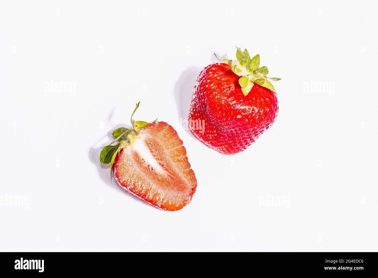Whole and half ripe strawberry isolated on white background. Sweet ...
