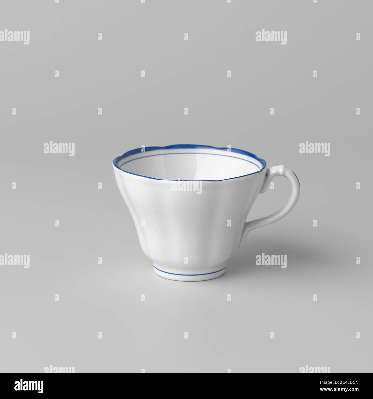 Cup with ear, white, with blue piping. Cup with ear of pottery ...