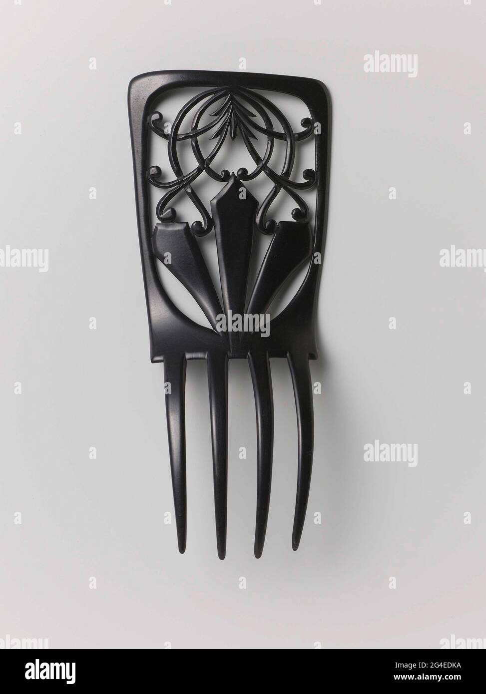 . Hair comb of black lacquered wood with elongated rectangular ajour ...