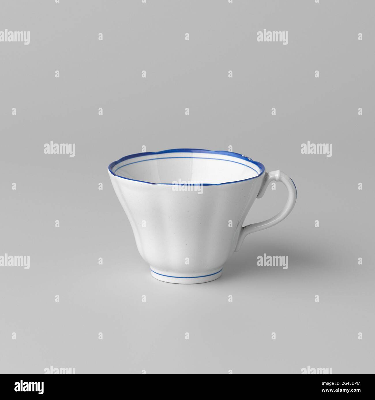 Cup with ear, white, with blue piping. Cup with ear of pottery ...