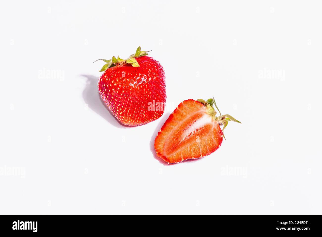 Whole and half ripe strawberry isolated on white background. Sweet ...