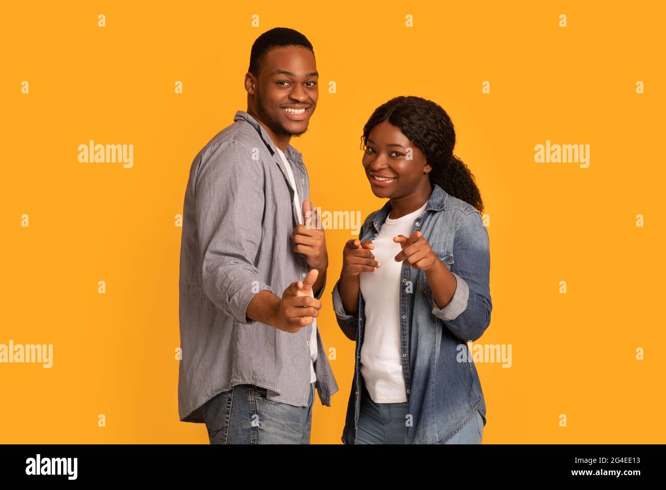 Positive African American Couple Pointing At Camera With Two Hands ...