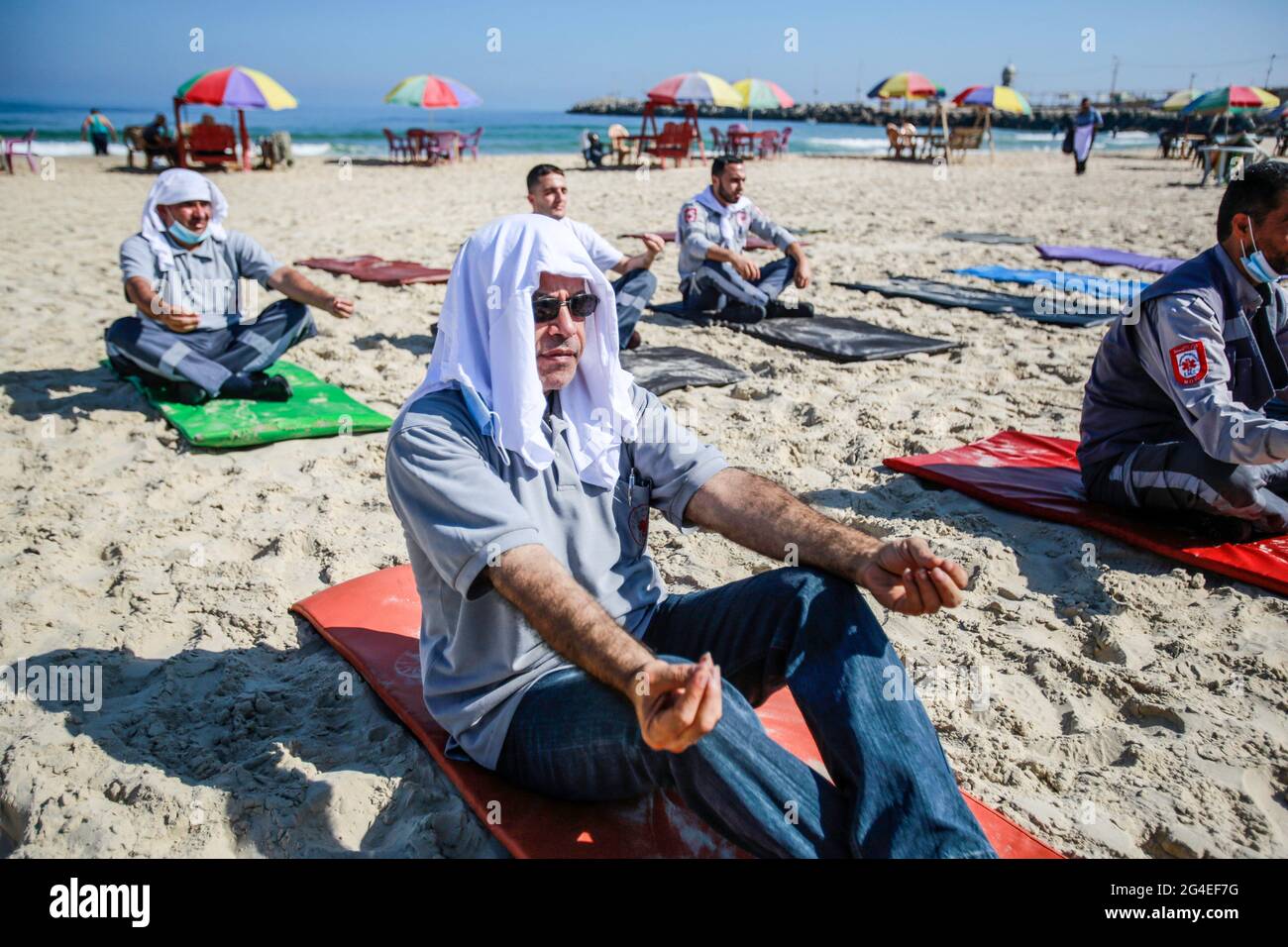 Palestinian paramedics practice yoga on a beach during the ...