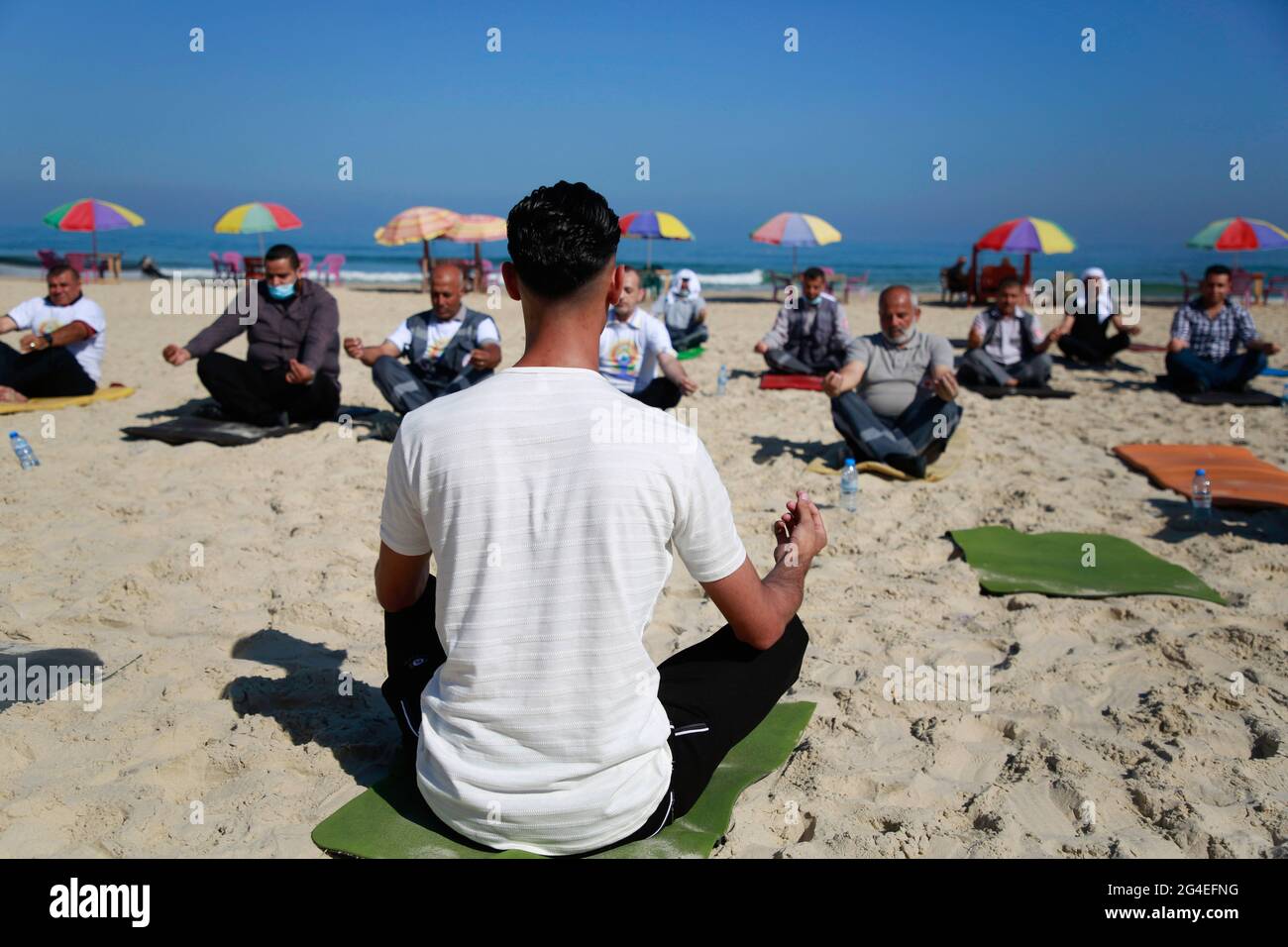 Palestinian paramedics practice yoga on a beach during the ...
