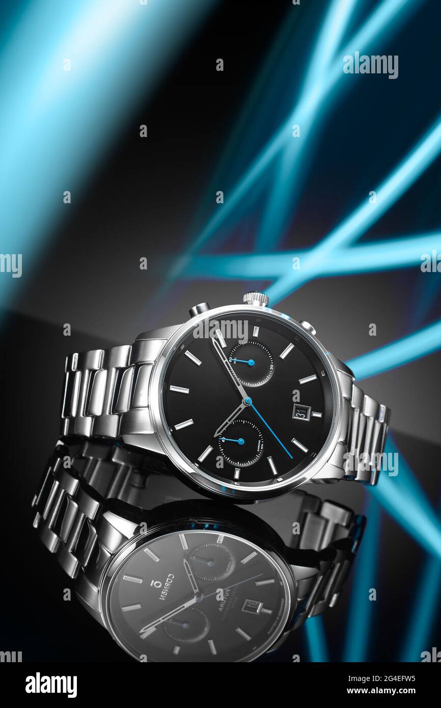 White men watch in futuristic blue background Stock Photo - Alamy