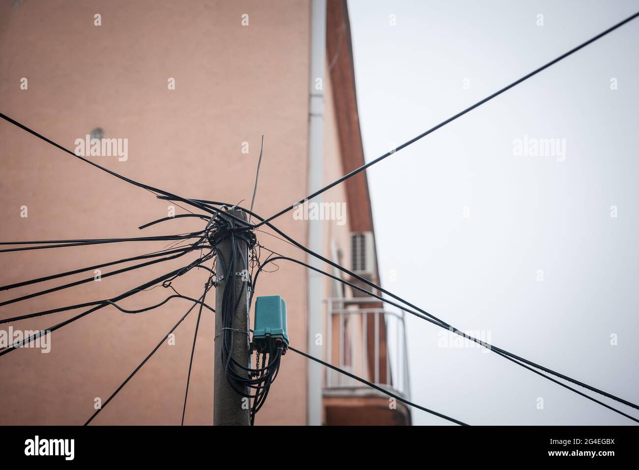 Picture of a messy power line connection with a lot of cables going ...