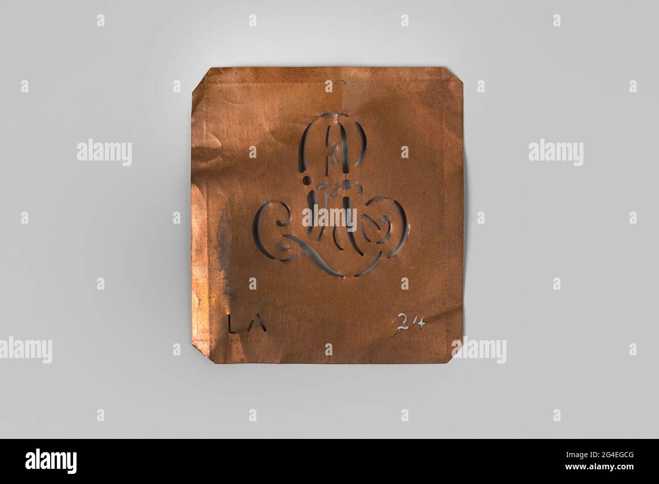 Red copper template, rectangular, with punched initials 'la', very fine ...