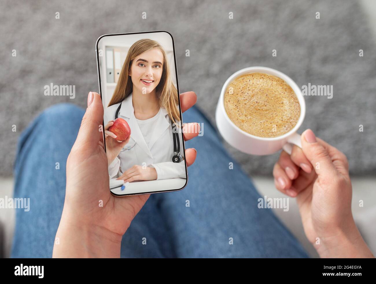 Woman having video chat with pretty doc, using phone Stock Photo - Alamy