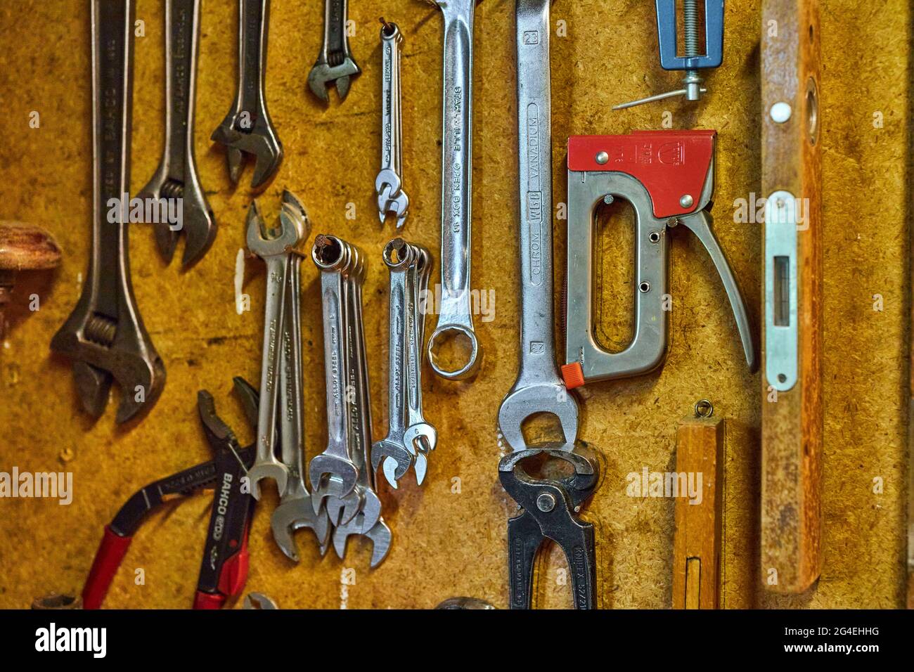 handyman tools hanging in a garden shed Stock Photo - Alamy