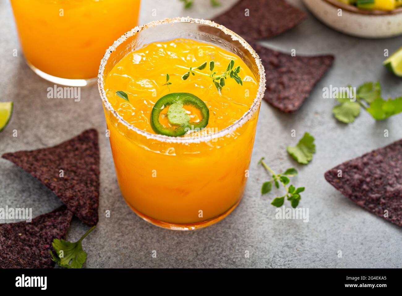 Pineapple and mango margarita with chips and guacamole Stock Photo - Alamy