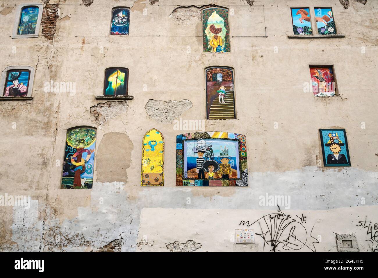Paintings on House with Art in Windows Stock Photo - Alamy