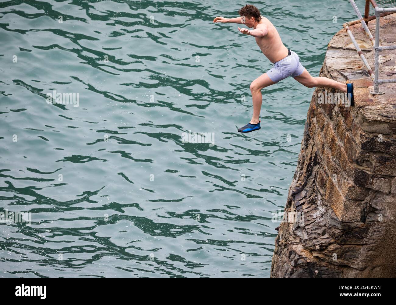 Swimmer jumping from rocks hi-res stock photography and images - Alamy
