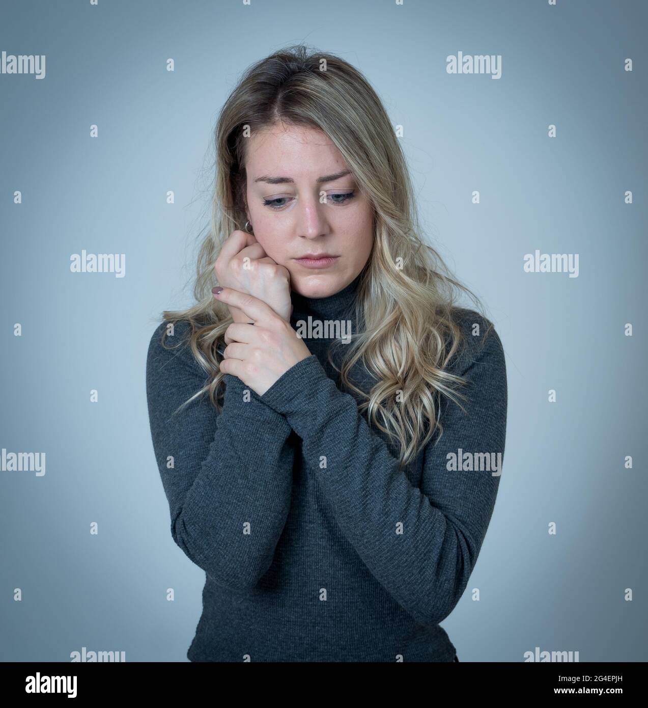 Portrait of young attractive caucasian woman suffering from depression ...