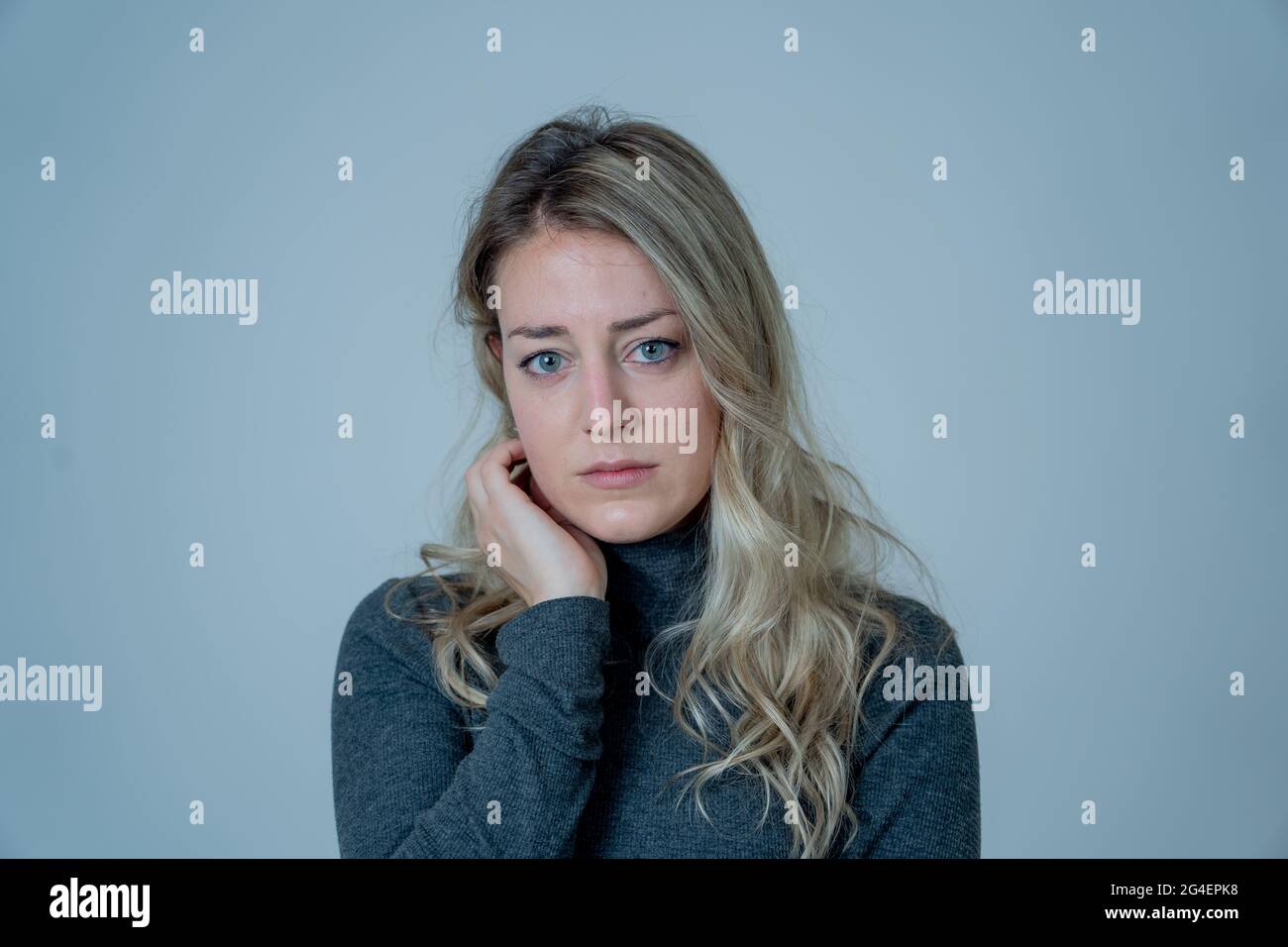 Portrait of young attractive caucasian woman suffering from depression ...