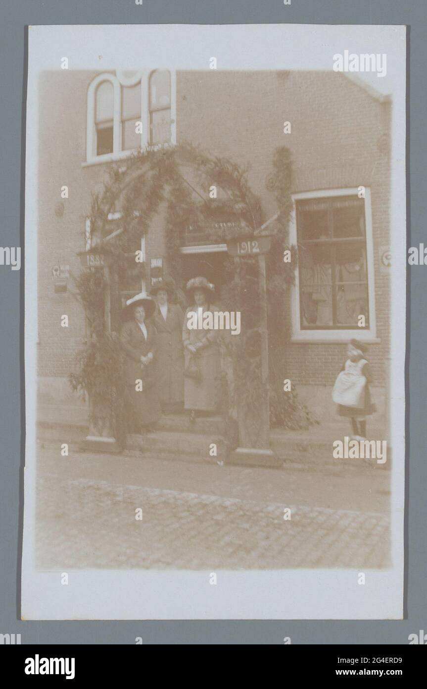 Three unknown women in front of a building Stock Photo - Alamy