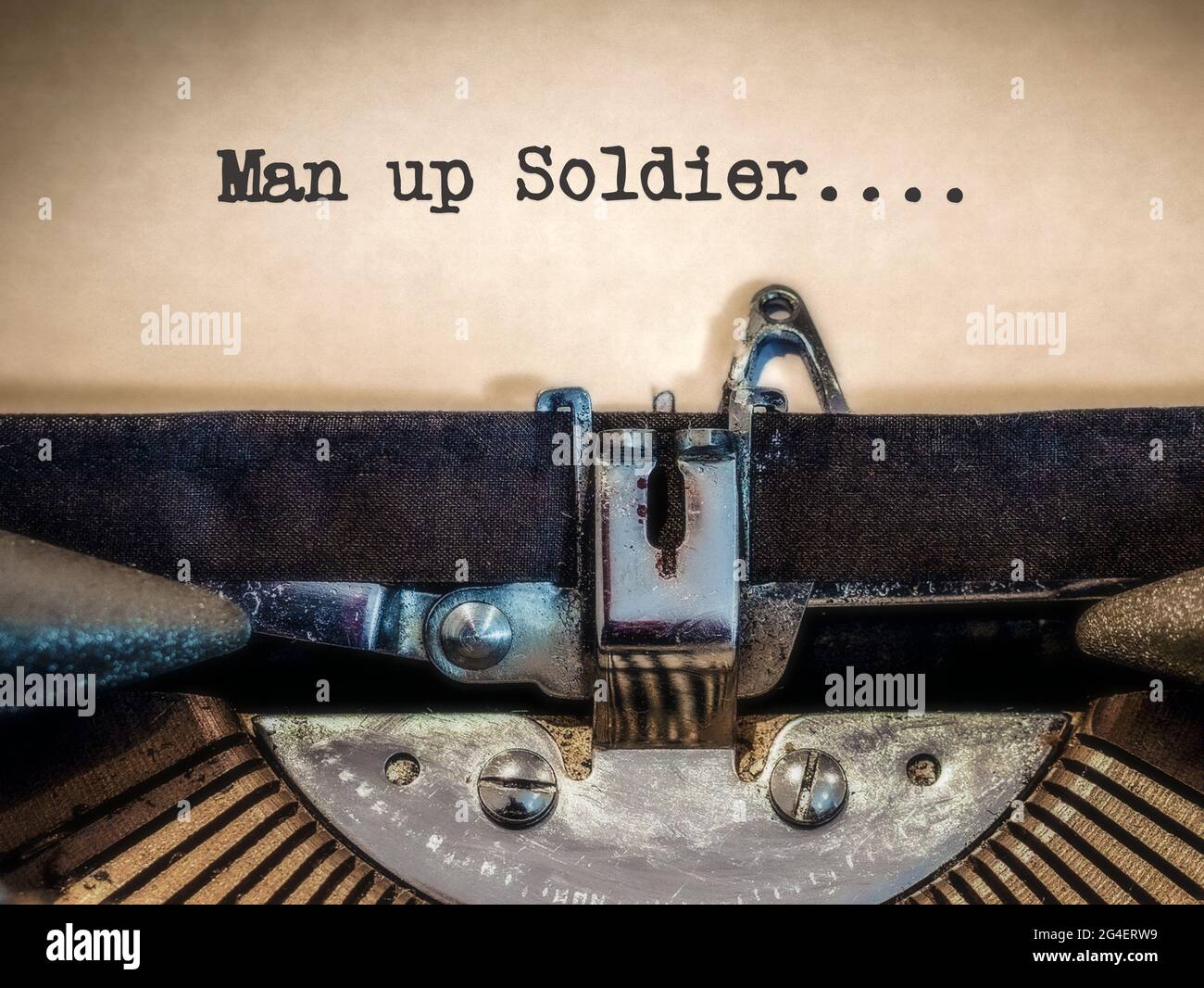 Man up Soldier displayed on a vintage typewriter Stock Photo - Alamy