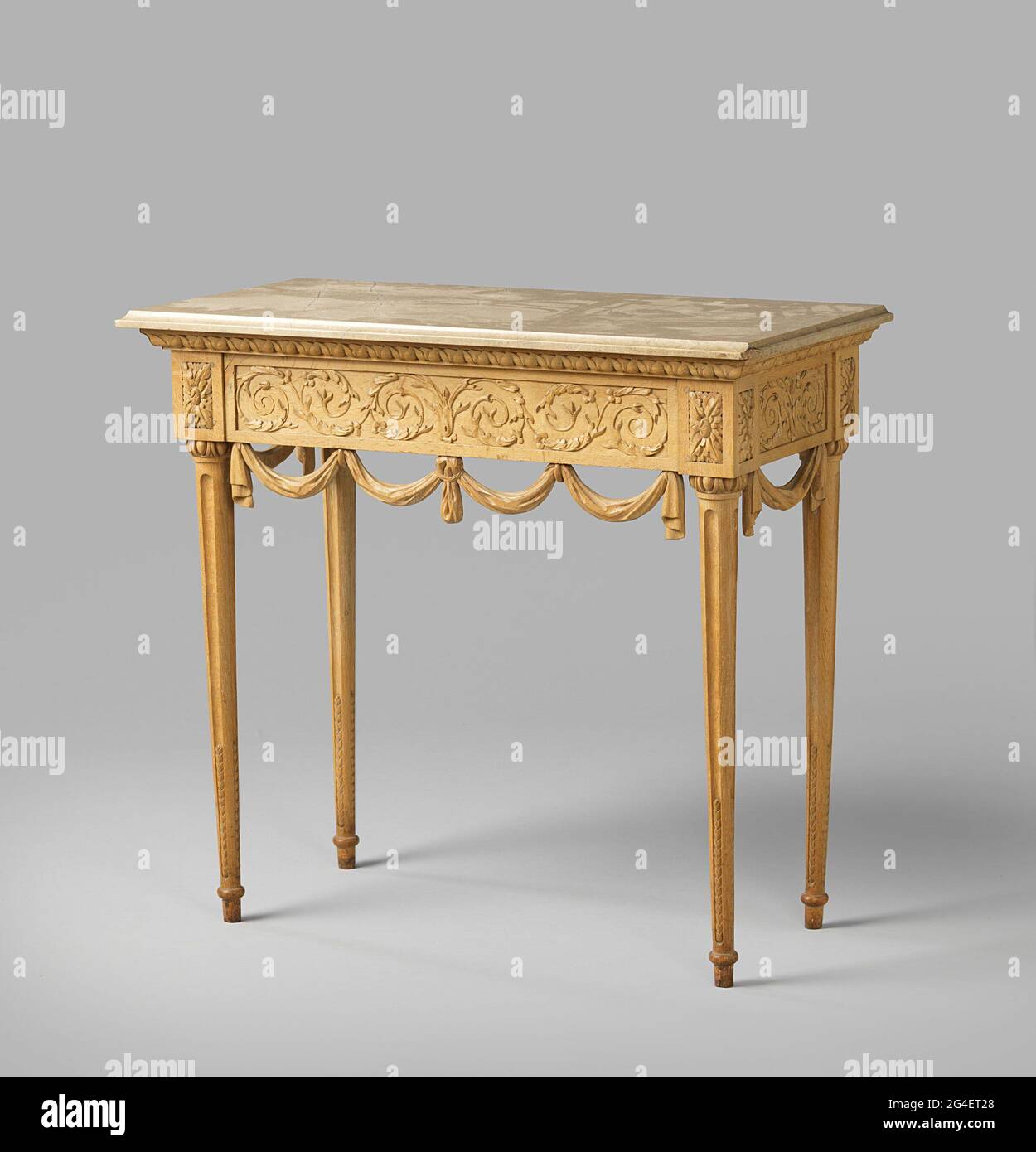 Penant table with fluted legs and acanthus and draperievers along the ...