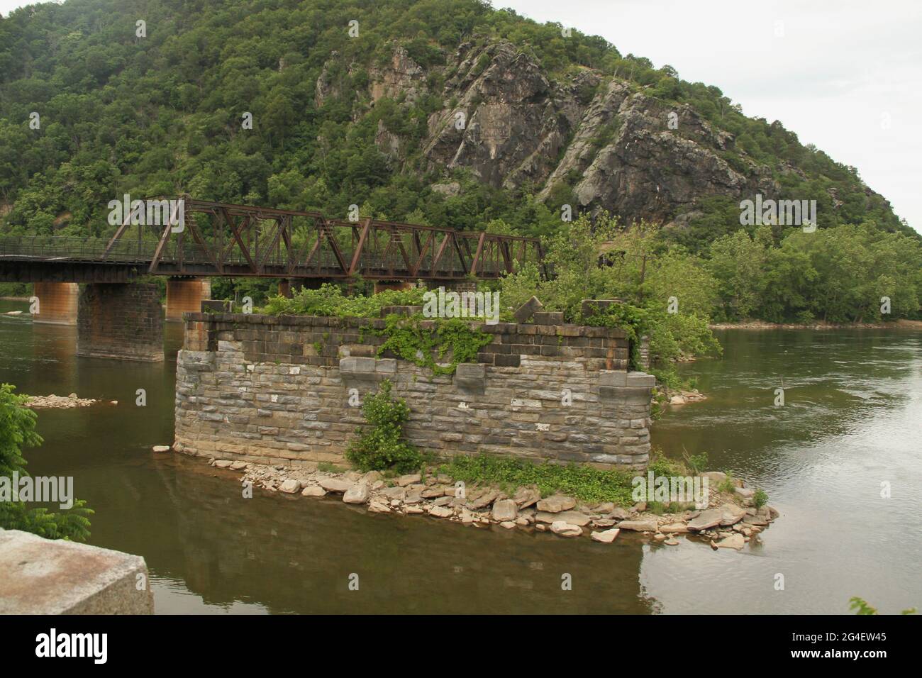 Harpers Ferry, WV, USA. The ruined pylons of the 1850 Bollman Bridge in ...