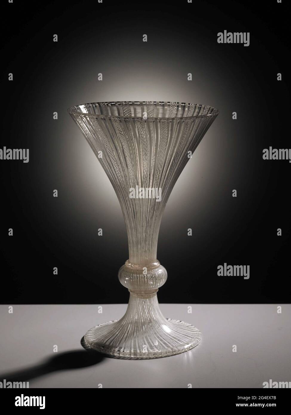 . Concave conic foot with folded edge. The stem made up of a hollow ...