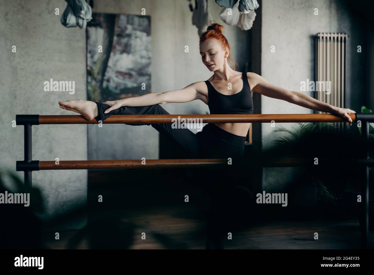 Flexible young ballet dancer stretching hi-res stock photography and ...