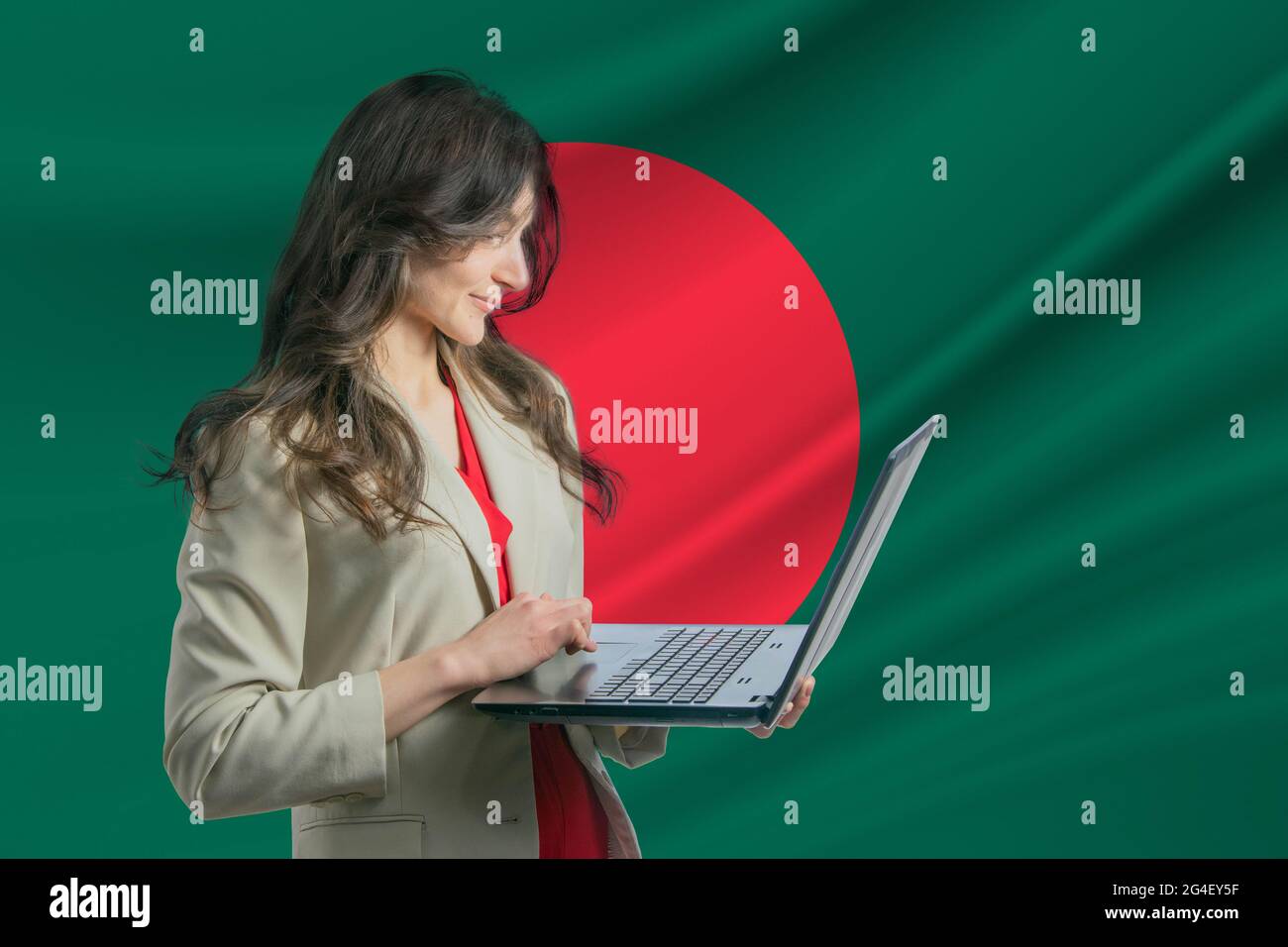 Freelance in Bangladesh. Beautiful young woman freelancer uses laptop computer against the ...