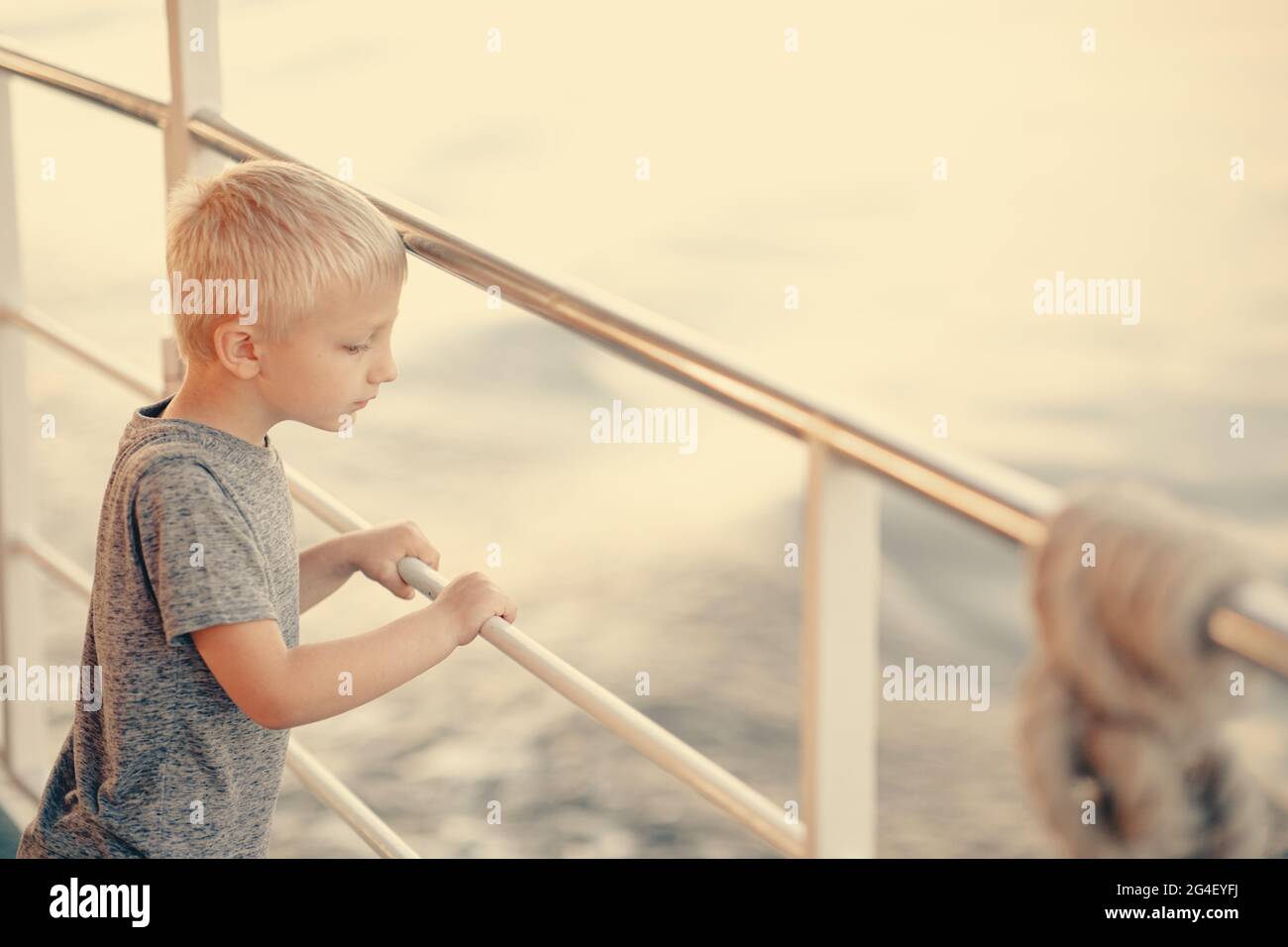a little boy aboard a large ship Stock Photo - Alamy