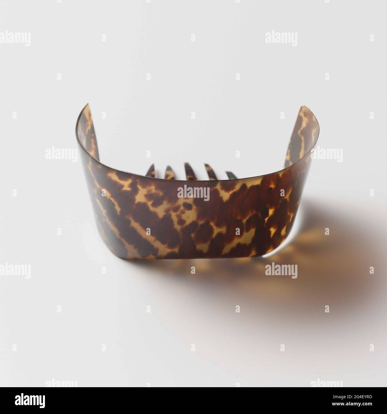 . Hair comb of imitation turtle with five teeth Stock Photo - Alamy