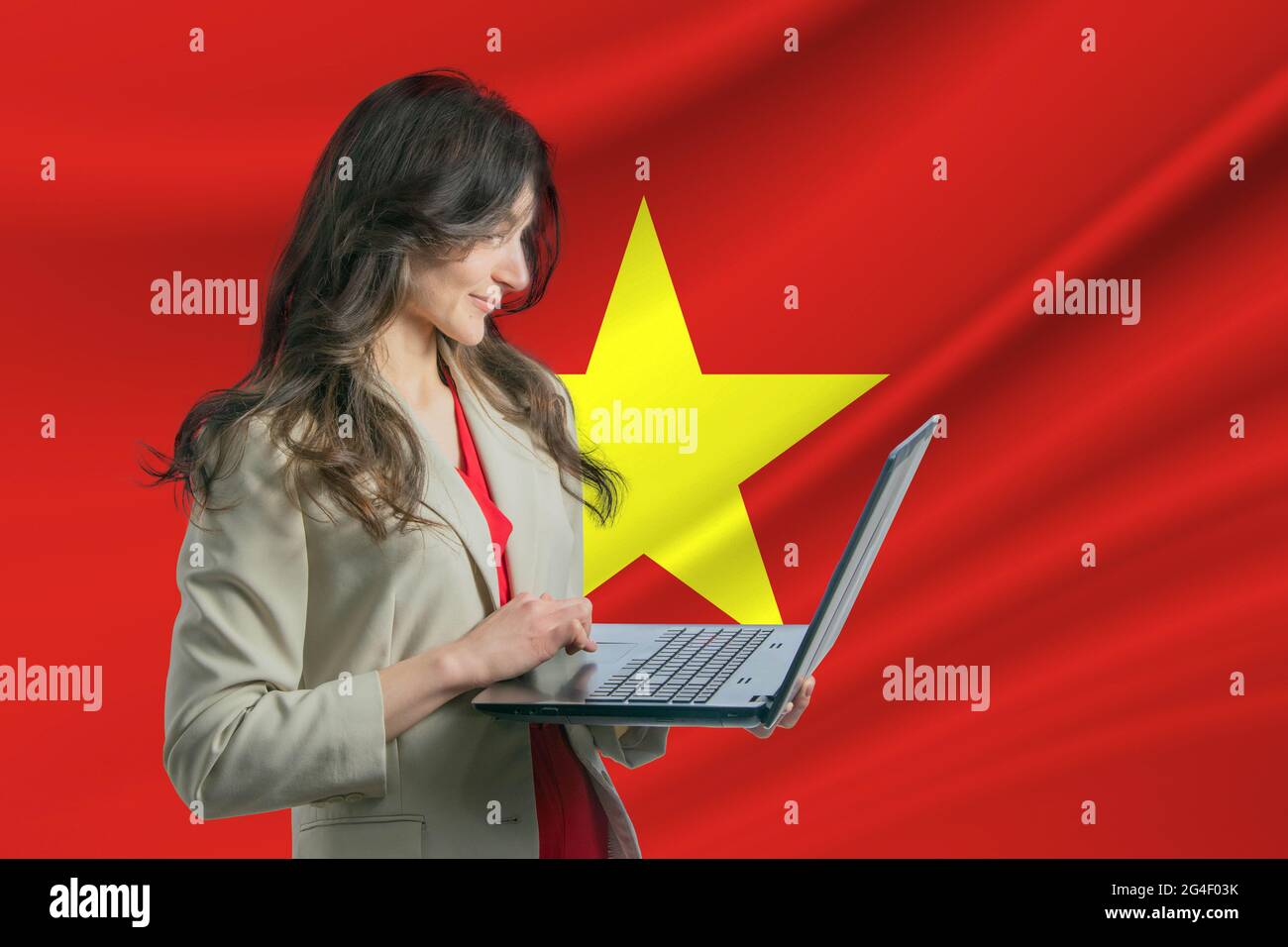 Freelance in Vietnam. Beautiful young woman freelancer uses laptop ...