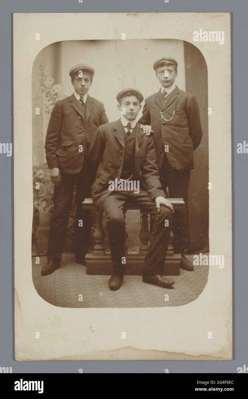 Studio portrait of three unknown young men Stock Photo - Alamy