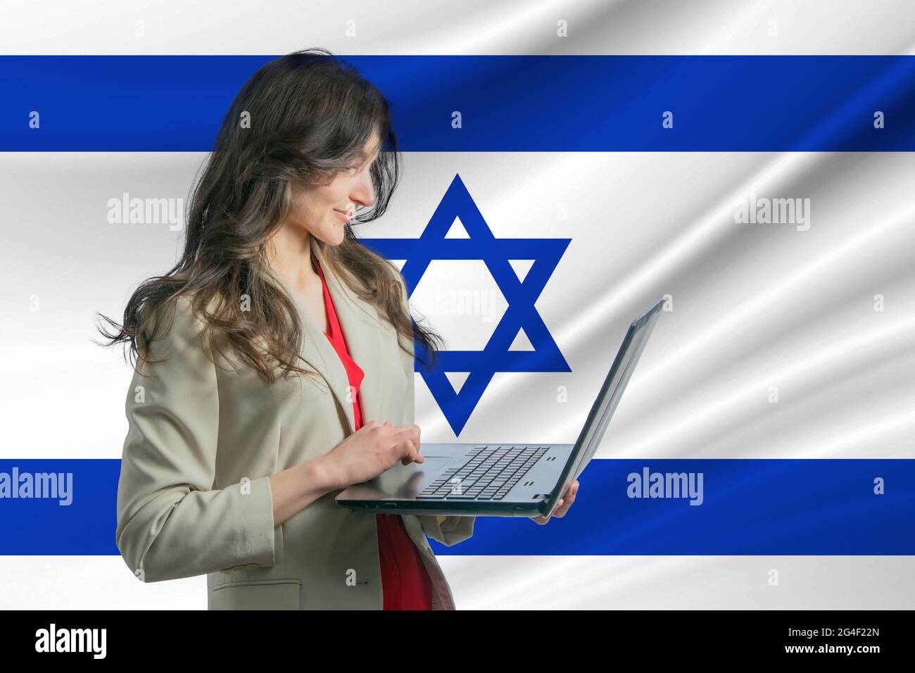Freelance in Israel Beautiful young woman freelancer uses laptop ...