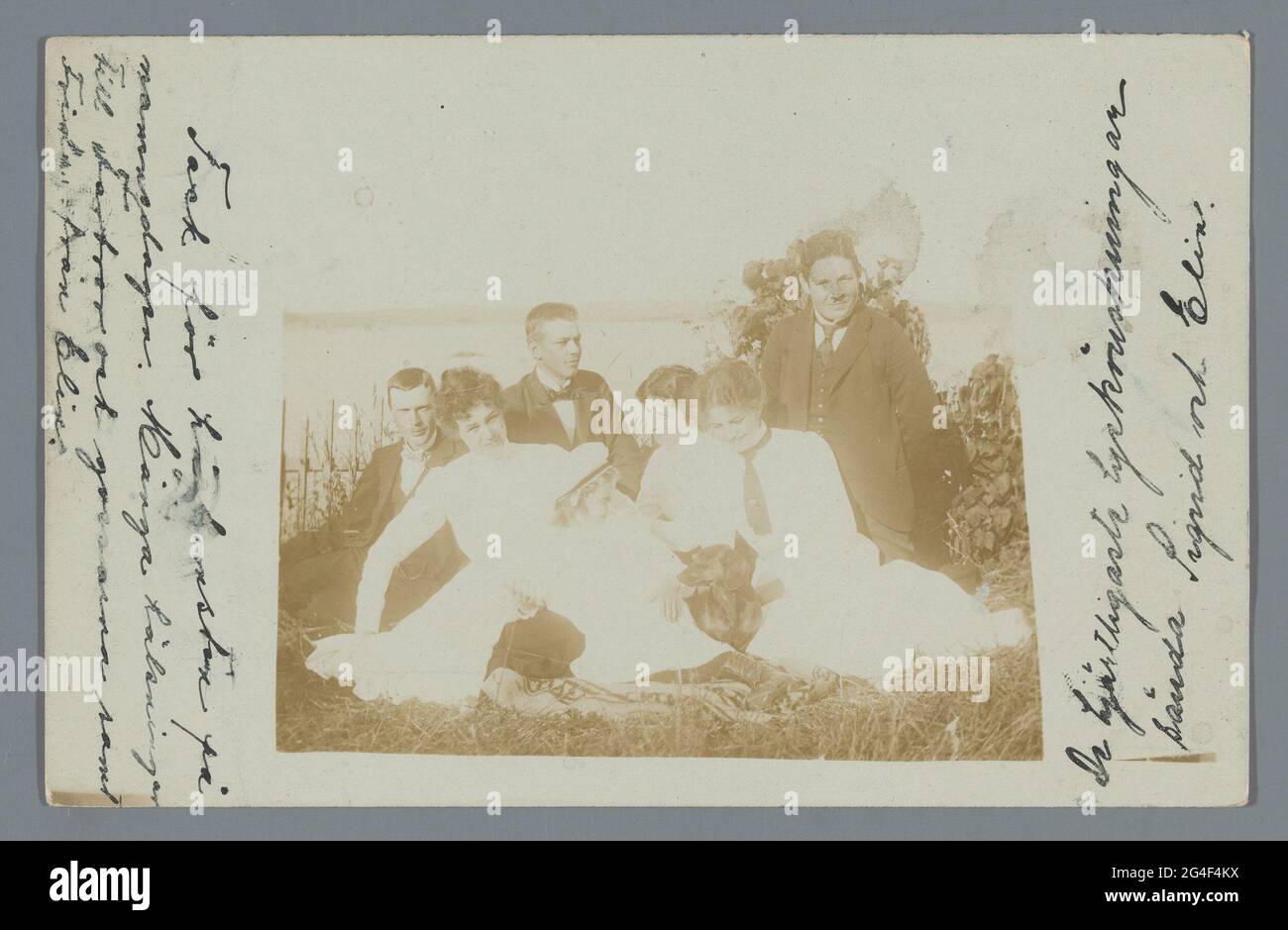 Group portrait of an unknown company for a lake Stock Photo - Alamy