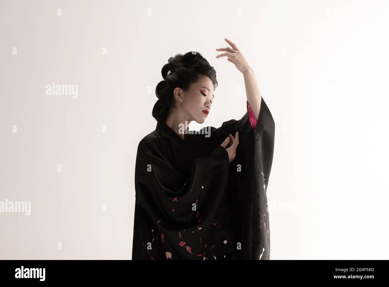 Portrait of young beautiful Japanese, woman in national attire kimono ...