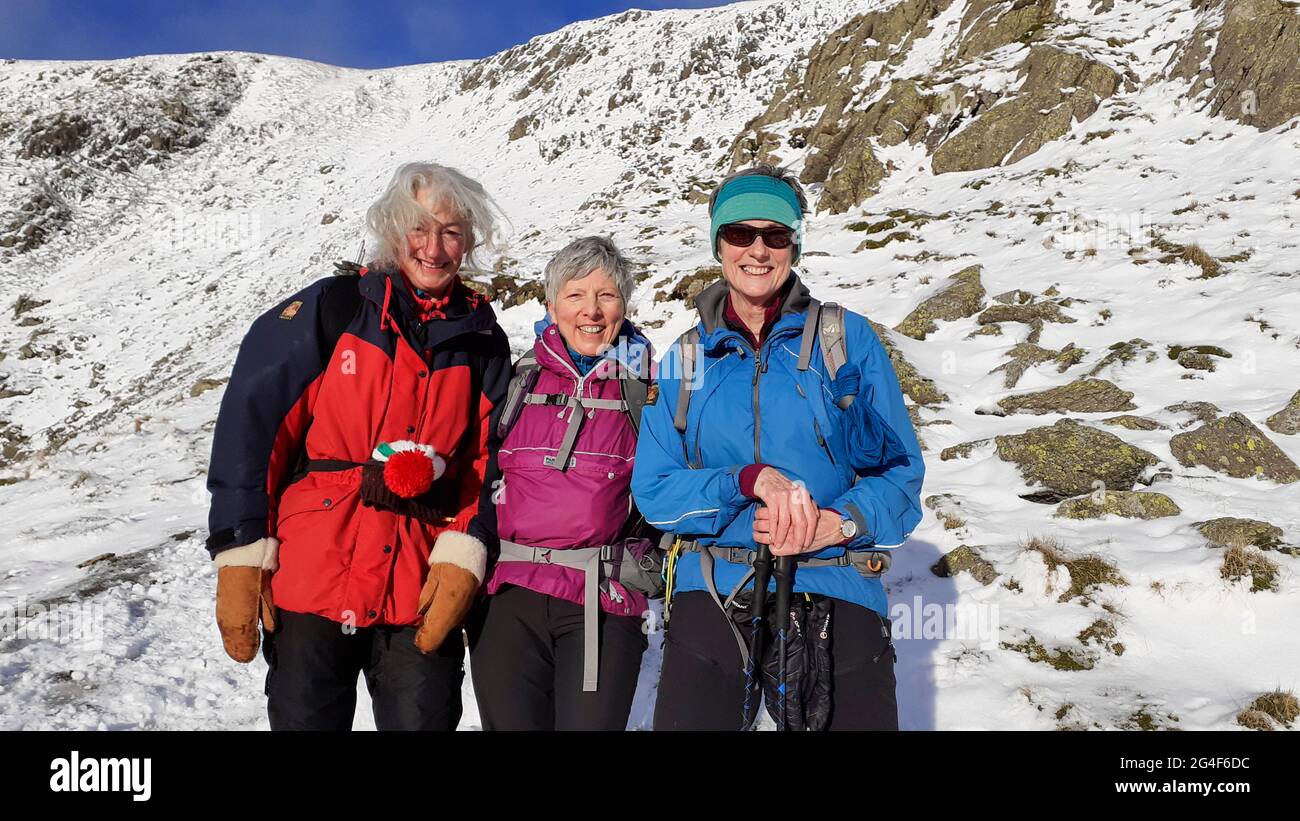 Women walking on Red Screes in winter, Lake District, UK Stock Photo ...