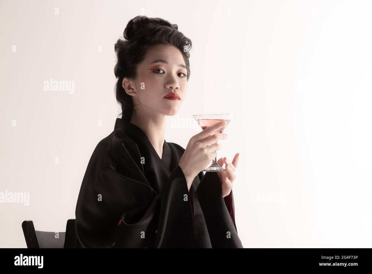 Portrait of young beautiful Japanese, woman in national attire kimono ...