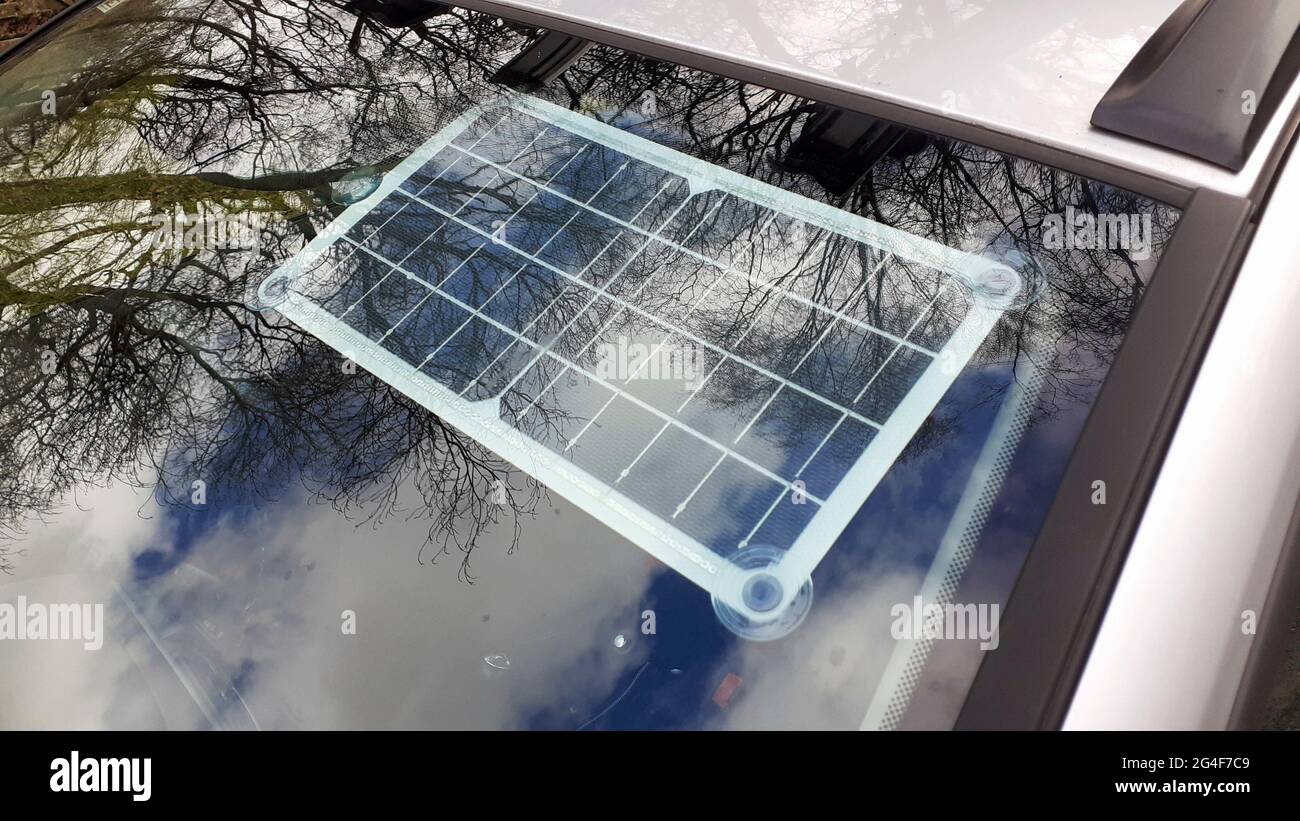 A solar panel on a car windscreen Stock Photo - Alamy