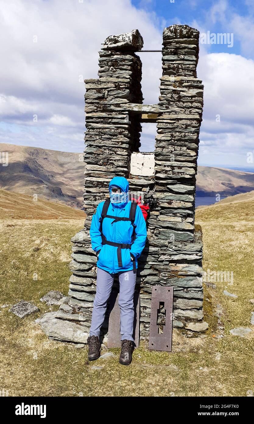 A survey tower on Tarn Crag in the Lake District used to survey a line ...