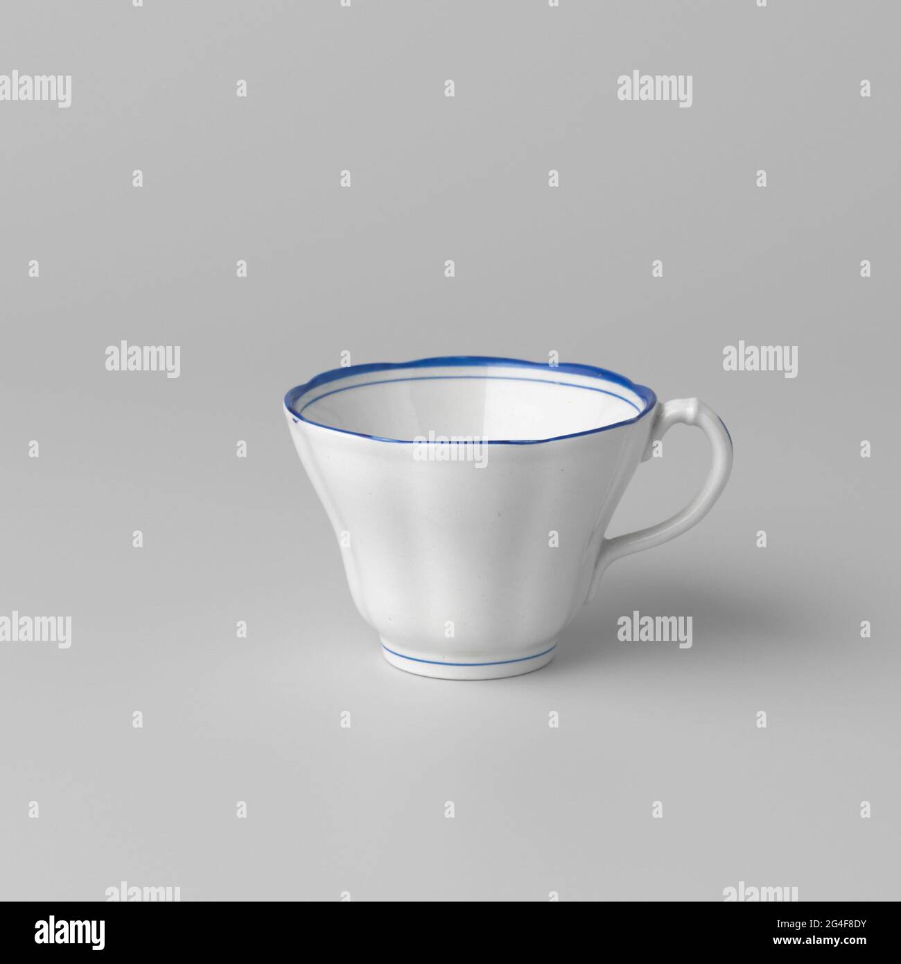 Cup with ear, white, with blue piping. Cup with ear of pottery ...