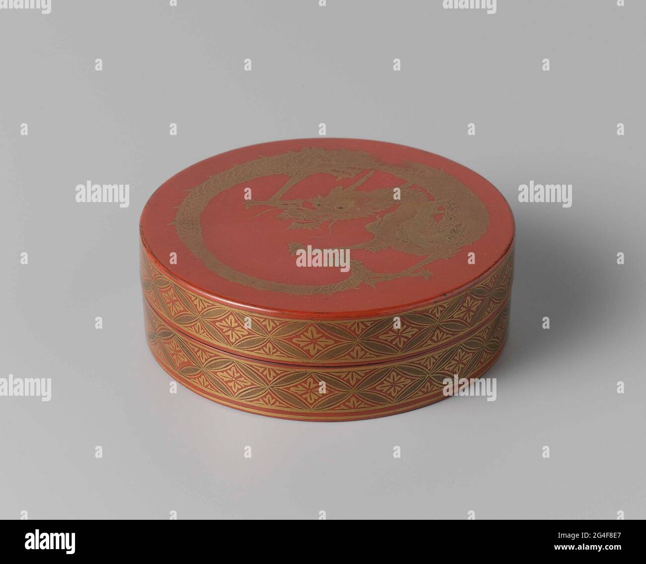 . Round, red lacquer box, decorated with dragon in golden lacquer Stock ...
