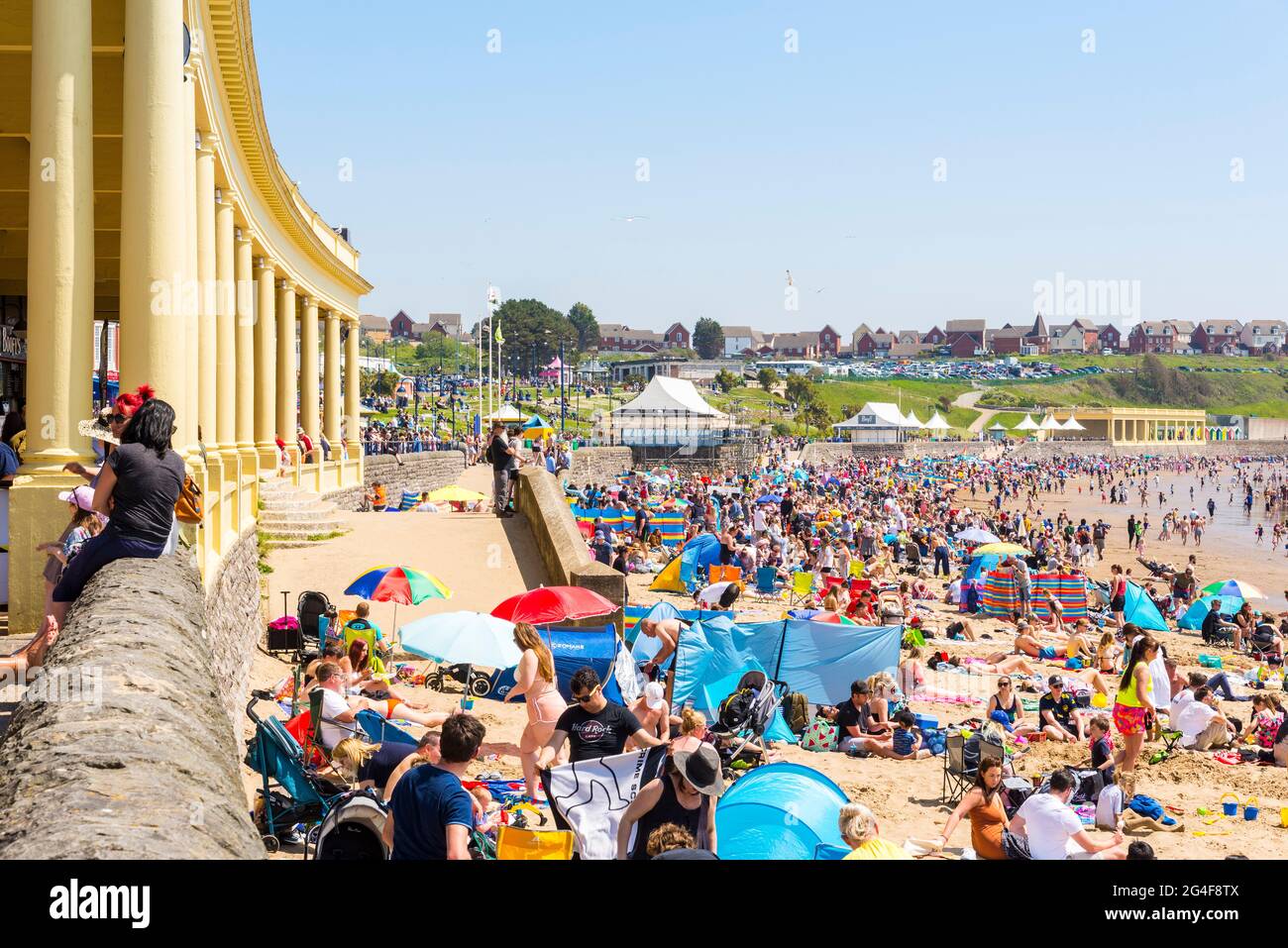 The beach at Barry Island seaside resort is crowded on a sunny Spring ...